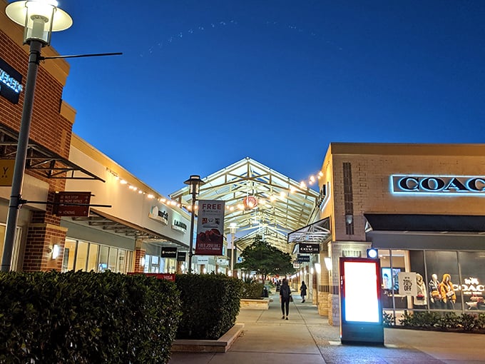 The evening glow transforms Houston Premium Outlets into a shopper's paradise, where Coach and other luxury brands beckon with promises of designer deals.