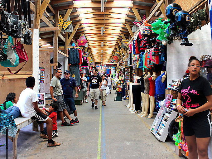The wooden beams overhead create a cathedral-like atmosphere for this temple of commerce, where shoppers hunt for deals with religious devotion.