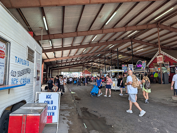 The covered pavilions at First Monday Trade Days offer shade and endless treasures, where Taylor's Old Fashioned Ice Cream beckons sweaty shoppers like a mirage in the Texas heat.