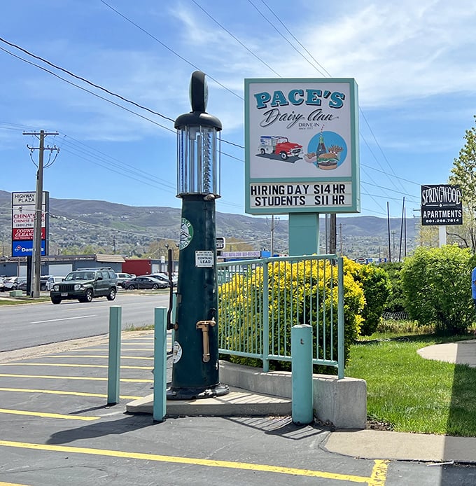 That vintage gas pump beside the sign isn't just decoration&mdash;it's a metaphor for this place: classic, functional, and impossible to improve upon.
