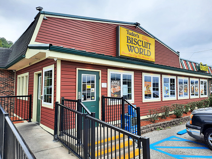 The iconic red-roofed Tudor's Biscuit World stands like a beacon of breakfast hope in Nitro, promising carb-laden bliss to all who enter.