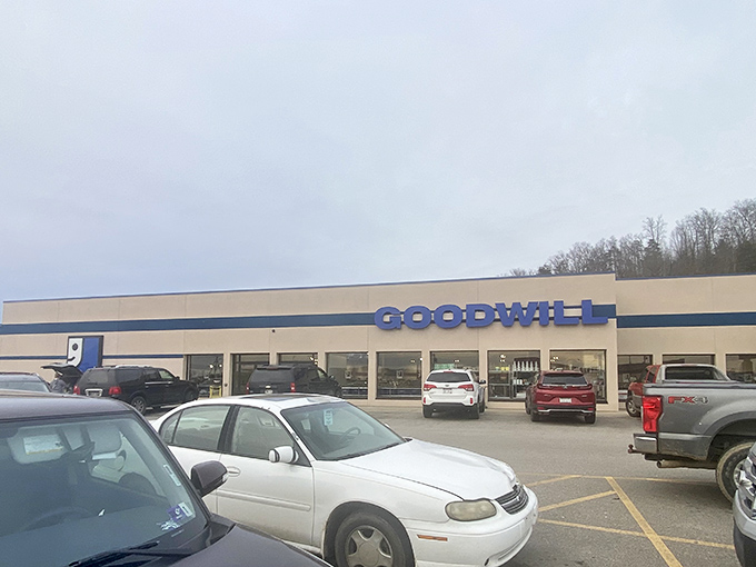 The blue Goodwill sign stands out like a retail lighthouse, guiding bargain hunters to shores of unexpected treasures in Hurricane.