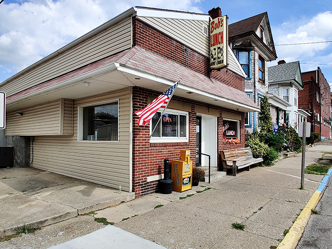 The unassuming brick exterior of Bob's Lunch stands like a time capsule on Moundsville's street, complete with wooden bench and American flag&mdash;culinary treasures often hide in plain sight.