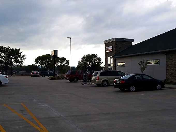 A spacious parking lot welcomes bargain hunters to this thrifting paradise, where your car arrives empty but leaves filled with affordable finds.