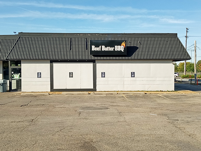 The blue corrugated roof and flame-adorned sign are like a beacon for barbecue pilgrims. Simple exterior, extraordinary flavors await inside.
