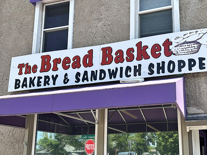 That purple awning is your beacon of hope in a world of mediocre baked goods and broken dreams.