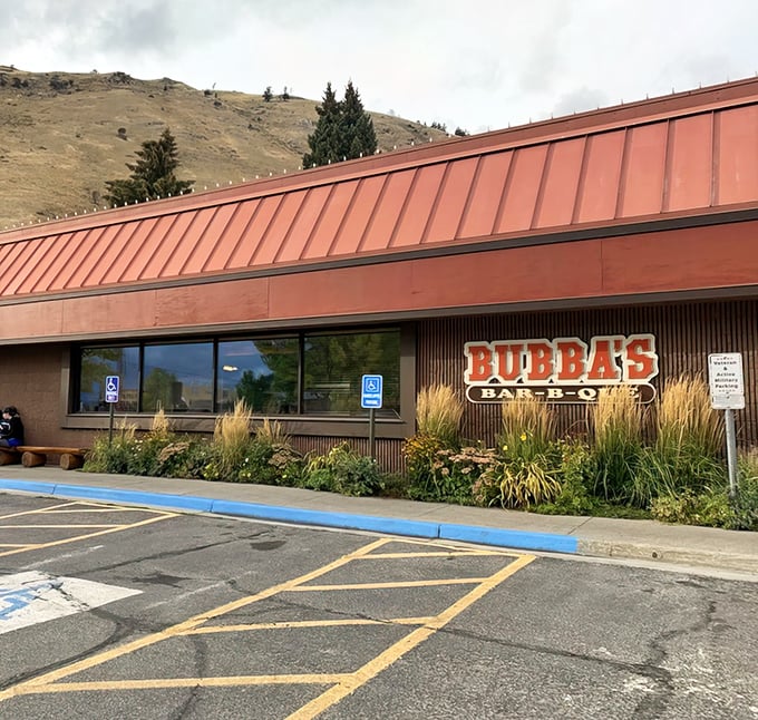 Bubba's iconic red roof stands out against Wyoming's rolling hills like a beacon for barbecue pilgrims. The promise of smoke and spice awaits.