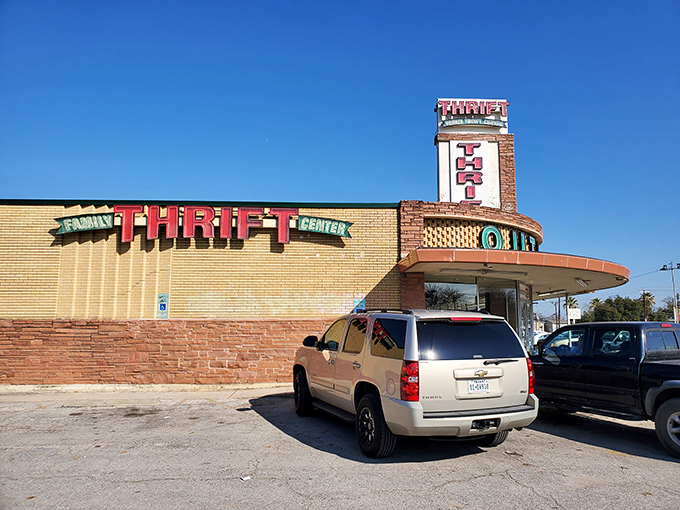 The retro signage of Family Thrift Outlet stands like a mid-century monument to bargain hunting, promising treasures within those yellow brick walls.