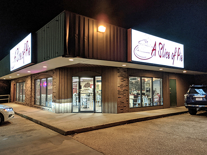 The glowing sign of A Slice of Pie beckons like a lighthouse for dessert sailors lost in a sea of mediocre sweets.