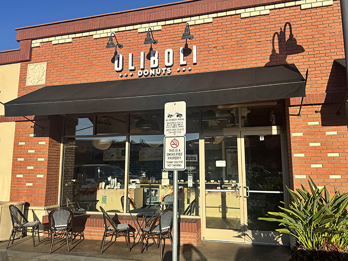 The brick facade of Oliboli Donuts stands like a temple to fried dough, promising sweet salvation to all who enter its hallowed doors.