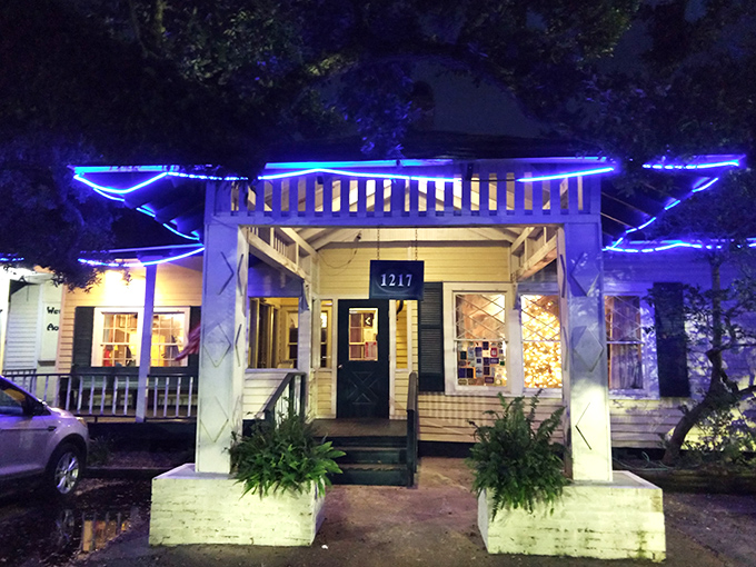 The blue-lit cottage at night isn't just a restaurant&mdash;it's a beacon of Southern comfort calling hungry travelers home.