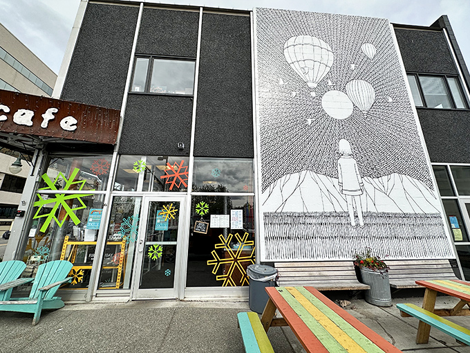 The iconic rust-colored sign welcomes hungry patrons like a beacon of breakfast hope in downtown Anchorage. Morning salvation awaits!