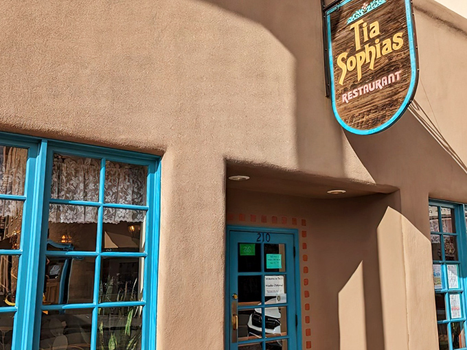The unassuming adobe exterior with its turquoise trim whispers Santa Fe's culinary secrets. Like finding a treasure map where X marks the breakfast spot. 