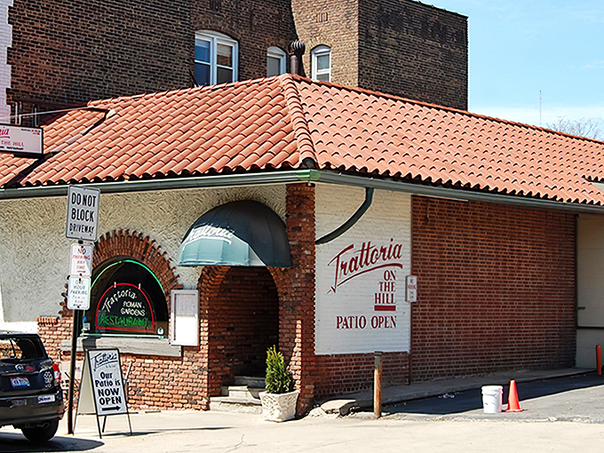 The terra cotta roof and brick facade of Trattoria Roman Garden isn't just charming&mdash;it's a Little Italy landmark that promises culinary magic within.