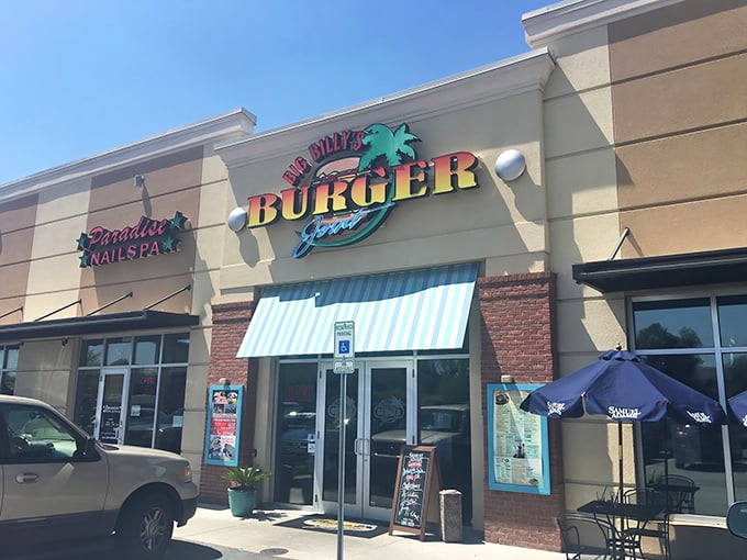 Where beach vibes meet burger bliss &ndash; Big Billy's exterior might be modest, but that neon palm tree promises tropical flavor adventures.