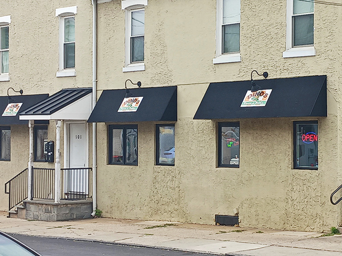 The unassuming exterior of Dino's Pizza & Pasta in Bridgeport hides culinary treasures within, like a delicious secret waiting to be discovered.