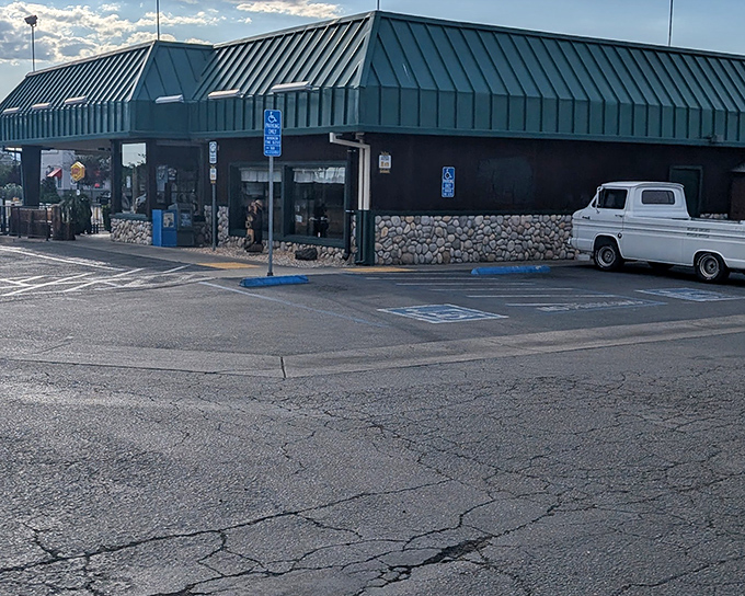 The iconic green-roofed exterior of Black Bear Diner stands like a woodland lodge that somehow wandered into Redding and decided to stay put.