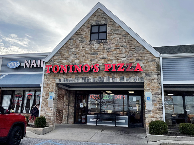 Stone facade, bold red lettering, and a simple bench out front&mdash;Tonino's doesn't need fancy frills when the pizza inside speaks volumes.