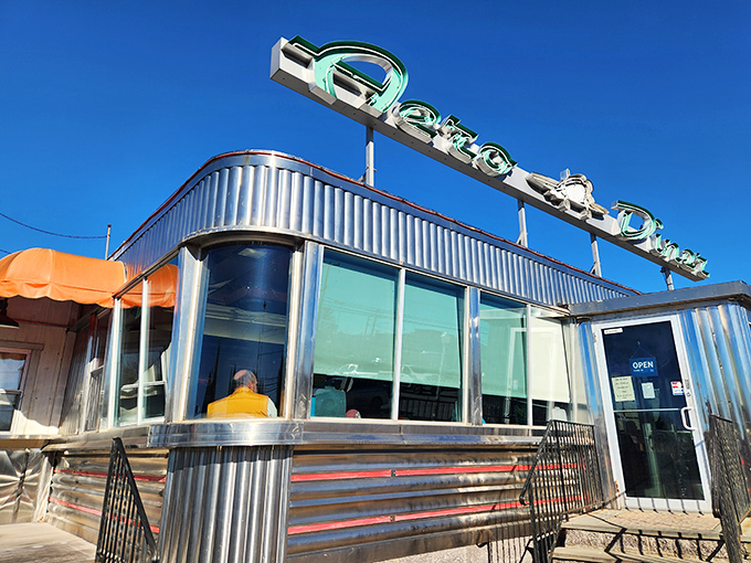 The gleaming stainless steel exterior of Aero Diner catches the morning sun like a beacon for hungry travelers seeking breakfast nirvana.