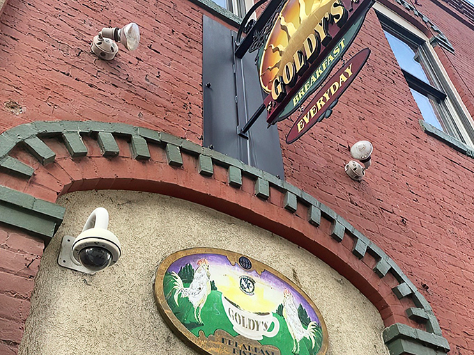 The iconic red brick facade of Goldy's, topped with its bright yellow sign, stands like a breakfast beacon in downtown Boise. Worth every minute in line.