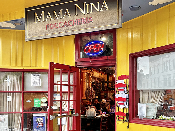 The sunshine-yellow exterior of Mama Nina's isn't just a building&mdash;it's a promise of warmth waiting inside. Those red-trimmed doors practically beckon you in from Bethlehem's historic streets.