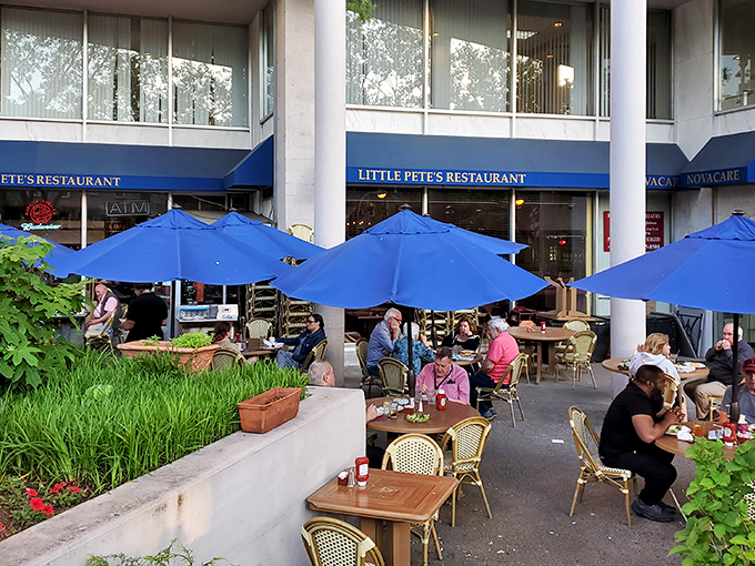 Blue umbrellas and sunshine create the perfect backdrop for people-watching and sandwich-devouring in downtown Philadelphia.