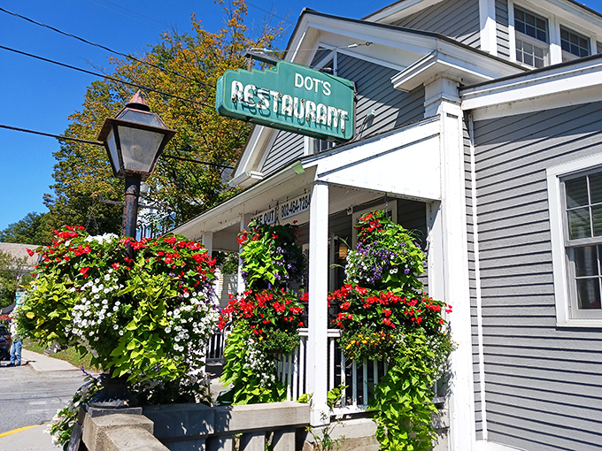 Dot's welcomes you with a burst of colorful hanging flowers and that iconic green sign&mdash;like Vermont itself is saying "Come on in, we've got breakfast!"