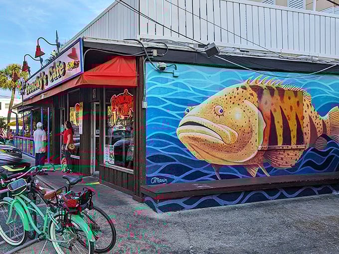 A vibrant grouper mural adorns Frenchy's exterior, proudly announcing the star of their menu to passersby in colorful Florida style.