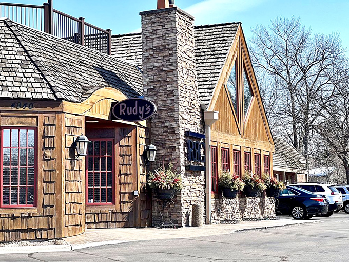 The rustic stone and cedar exterior of Rudy's beckons like a cozy North Woods cabin that happens to serve five-star cuisine.
