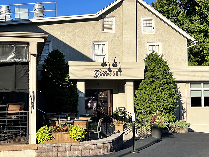 The stucco exterior of Grille 3501 welcomes you with understated elegance, like that friend whose home always feels more inviting than yours.