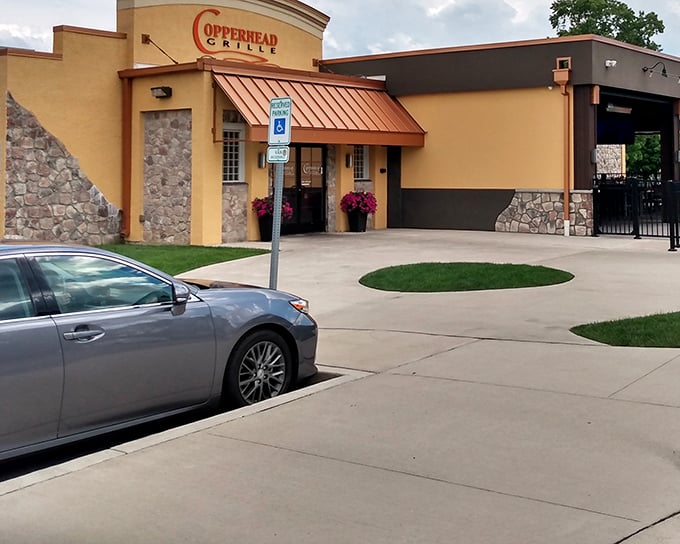 The warm terracotta exterior of Copperhead Grille welcomes you like an old friend who happens to make incredible chicken sandwiches.