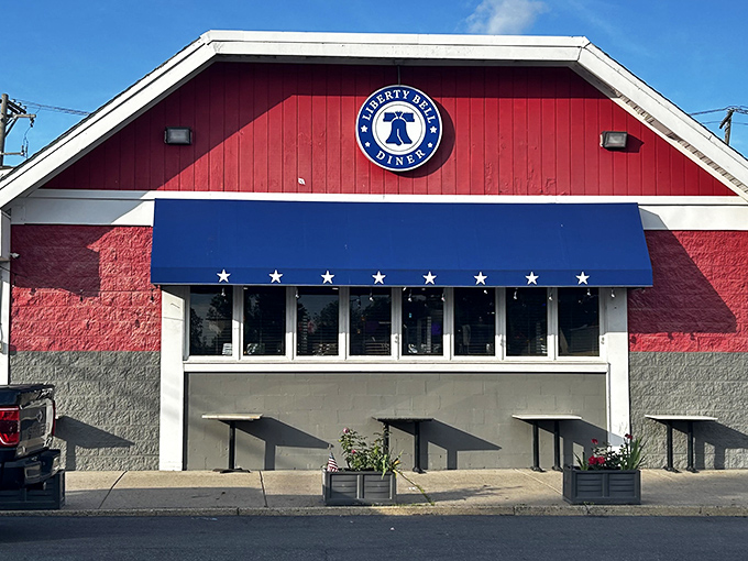 The Liberty Bell Diner's patriotic exterior stands proudly in Northeast Philly, where culinary treasures await behind that unassuming red facade.