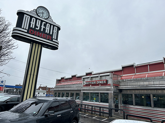 The gleaming stainless steel exterior of Mayfair Diner stands like a time machine on Frankford Avenue, beckoning hungry travelers with its classic Americana charm.