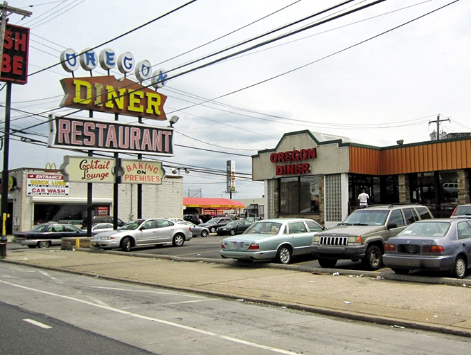 The iconic Oregon Diner sign stands like a beacon of breakfast hope on this South Philly corner.