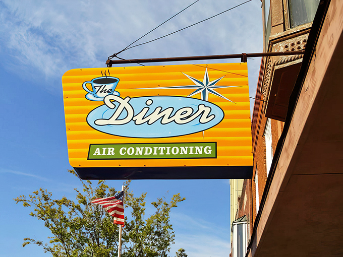 That iconic sign isn't just promising breakfast &ndash; it's announcing a time portal to when diners ruled America and "air conditioning" was worth advertising in neon.