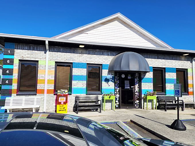 The colorful exterior of Early Bird Diner stands out like a rebellious art project on Savannah Highway, promising flavors as bold as its blue-striped facade.
