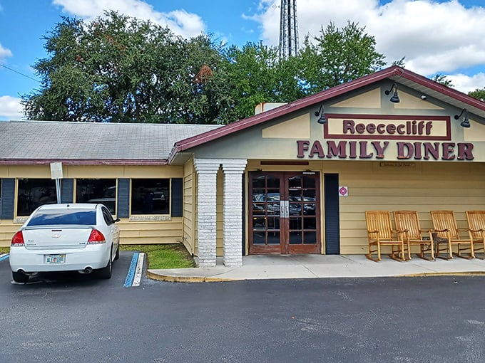 The full "Reececliff Family Diner" marquee stands proud against Florida skies, with those inviting rocking chairs practically begging you to "sit a spell" before your meal.