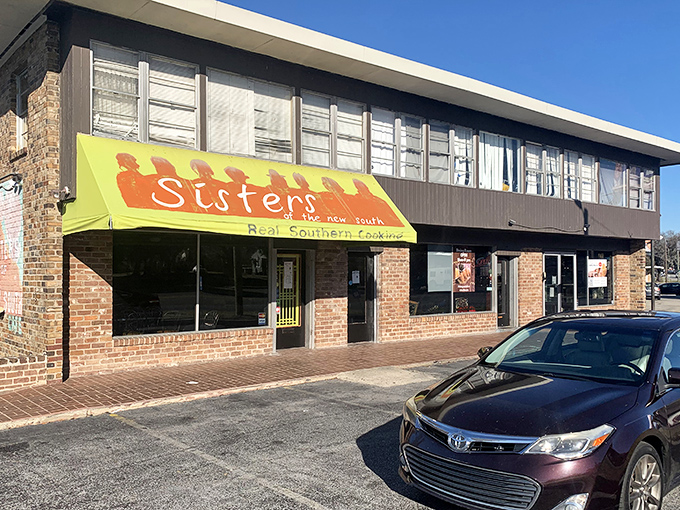 The bright yellow awning of Sisters of the New South stands out like a beacon of culinary promise on Skidaway Road. Southern comfort awaits inside these brick walls.