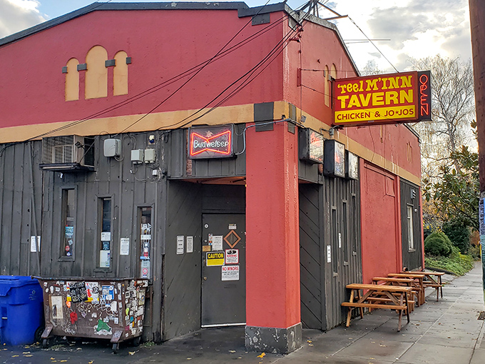 The red and black exterior of Reel M Inn stands like a defiant time capsule amid Portland's ever-changing landscape. This is where chicken dreams come true.