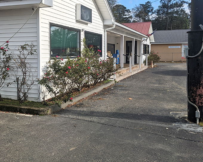 That white clapboard exterior hides some serious culinary magic, proving the best restaurants never need flashy signs.