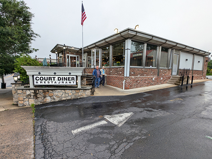 The classic brick-and-stone exterior of Court Diner welcomes you like an old friend who always knows what you need.
