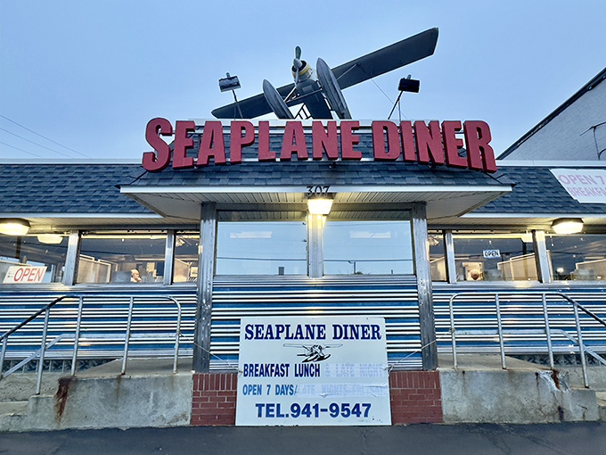 The iconic Seaplane Diner sign welcomes hungry travelers with its distinctive aircraft perched above&mdash;a beacon of breakfast hope on Allens Avenue.