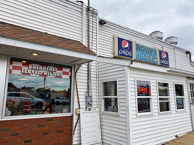 Rolly's Diner stands proudly in Auburn, its classic white exterior and vintage Pepsi signs promising breakfast bliss within.
