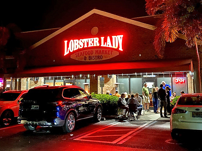 The glowing red sign of Lobster Lady beckons seafood pilgrims like a lighthouse for the gastronomically adrift. Even at night, the crowd outside proves some things are worth waiting for.