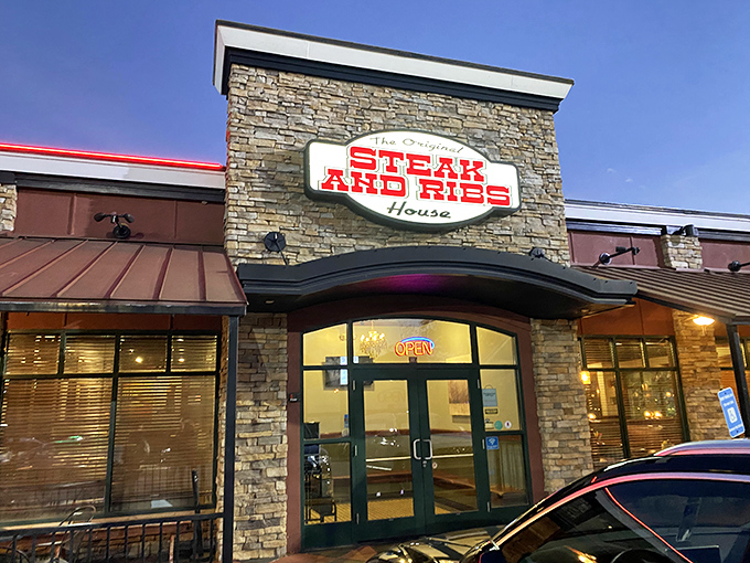 Stone facade, bold red signage, and that magical "OPEN" glow&mdash;the universal symbol for "abandon your diet plans immediately."