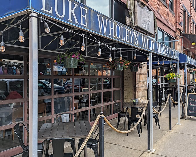 The blue awning of Luke Wholey's beckons like a maritime flag signaling "fresh seafood ahead." Nautical ropes and outdoor seating create an inviting harbor for hungry travelers.