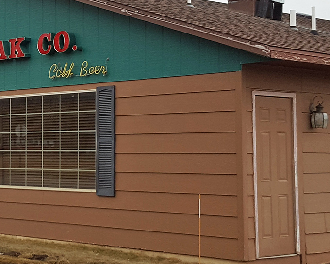 The unassuming exterior hides culinary treasures within, like finding a diamond in your backyard. That "Cold Beer" sign is the adult equivalent of a lighthouse beacon.