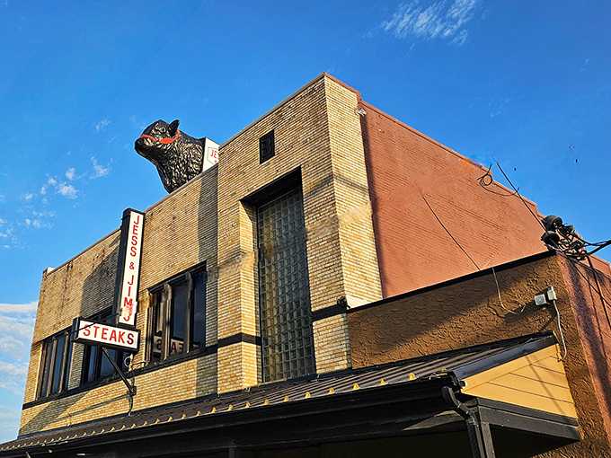 The iconic steer silhouette stands guard atop Jess and Jim's, a beacon for carnivores in Kansas City's Martin City.