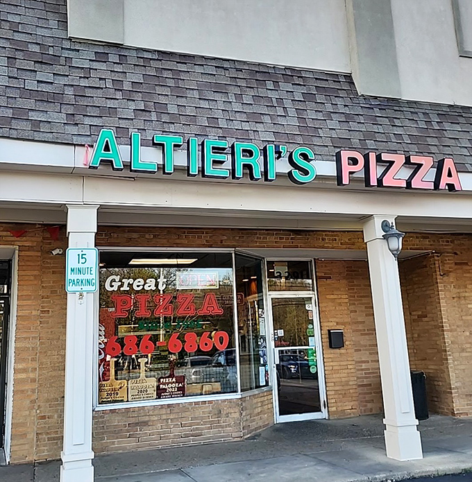 Unpretentious charm at its finest &ndash; Altieri's storefront promises what matters most: "Great Pizza" and a phone number to make that promise yours.
