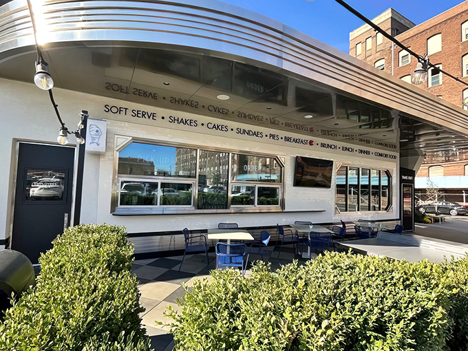 The gleaming silver exterior of Tops Diner stands like a beacon of culinary hope in East Newark, promising comfort food that transcends ordinary diner fare.